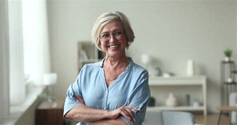 Happy Attractive Mature Woman In Glasses Posing At Home Stock Video