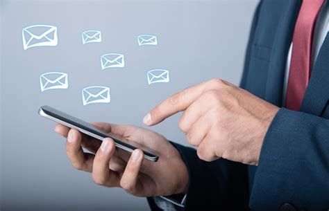 premium photo man hands using phone with digital email icons