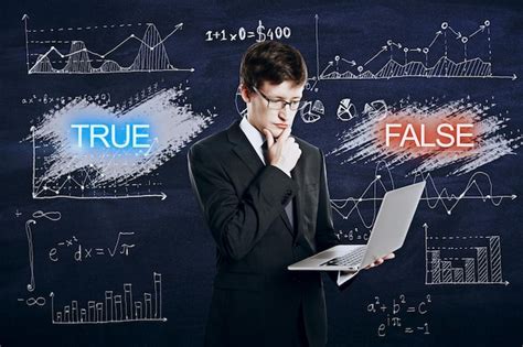 Premium Photo Attractive Thoughtful Young Businessman Holding Laptop