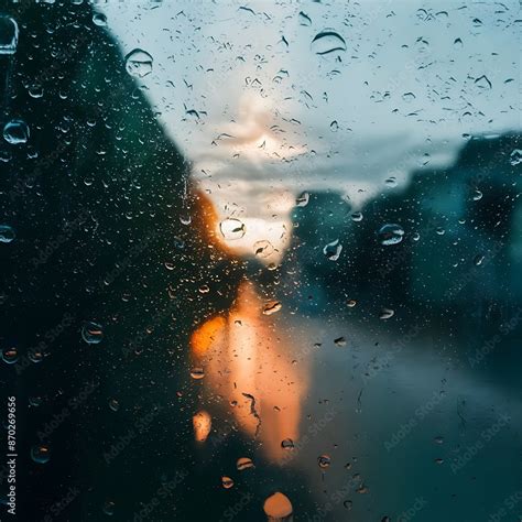 Image Showing The Sunset While It Is Raining Heavily Outside The Window