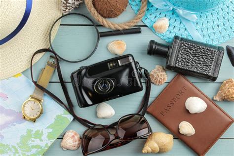 Travel Concept Hat Passport Map Camera And Sunglasses On A Light