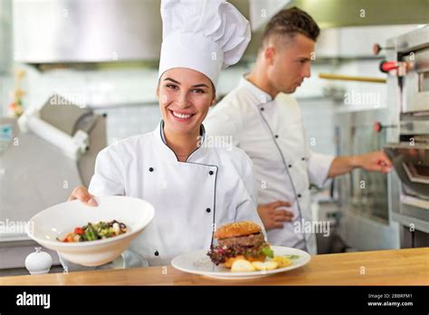 Female And Male Chefs In Kitchen Stock Photo Alamy
