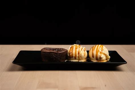 Dessert Of Chocolate Lava Cake And Vanilla Ice Cream With Caramel