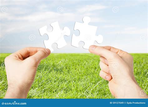 Two Hands Trying To Connect Puzzle Pieces Stock Image Image Of