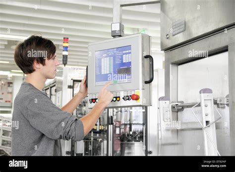 Man Using Control Panel In Brewery Stock Photo Alamy