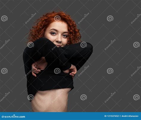 Beautiful Young Red Haired Girl With Curls Undresses Smiling At The
