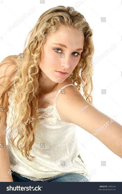 Portrait Of A Beautiful Blonde Model Looking Over Her Shoulder Stock