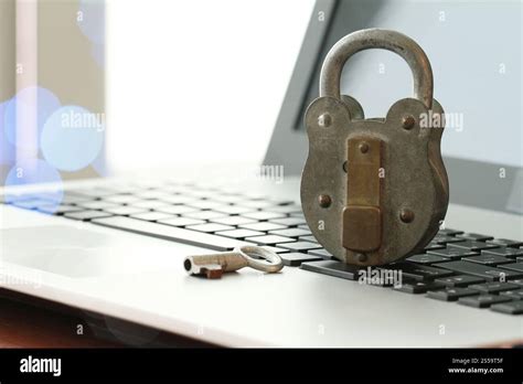Internet Security Concept Old Padlock And Key On Laptop Computer