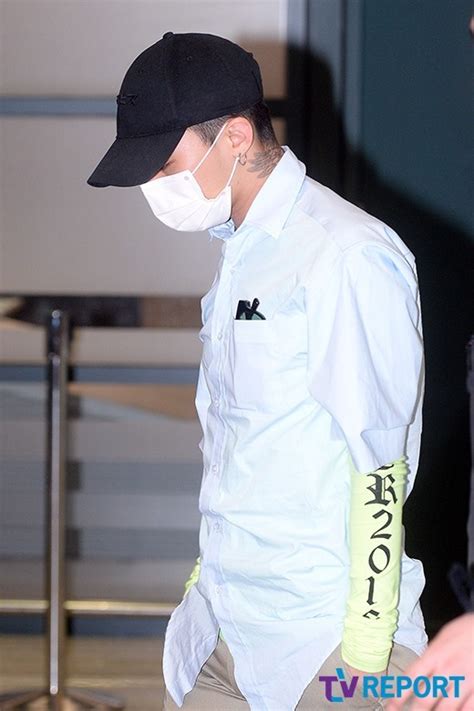 Bigbang现身机场返韩 权志龙口罩遮面top低调快走【组图】 4