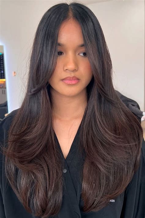 Feathered Front Layers On Long Hair For A Soft Bouncy Finish