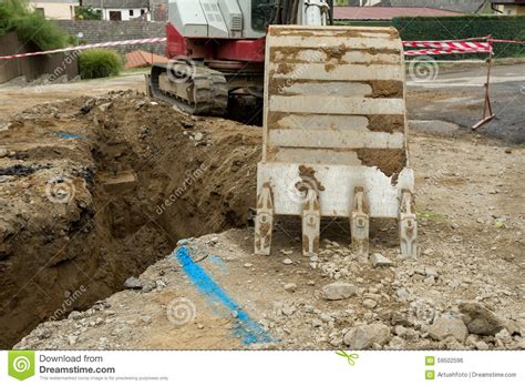 Excavator Dig Trench At A Construction Site Trench For Laying Sewer