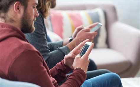 Young Man Using Smartphone Browsing Social Media Texting Messages