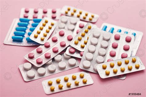 Assorted Pharmaceutical Medicine Pills Tablets And Capsules On Pink