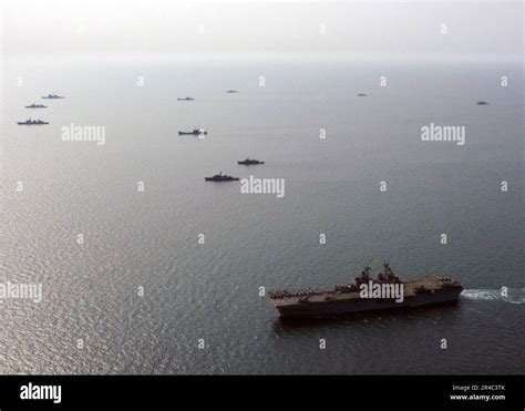 Us Navy Amphibious Assault Ship Uss Essex Lhd 2 In Formation With Us