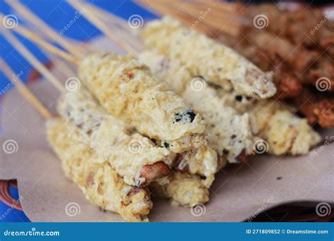 Photo Of Chicken Satay Coated With Fried Egg And Chicken Intestine