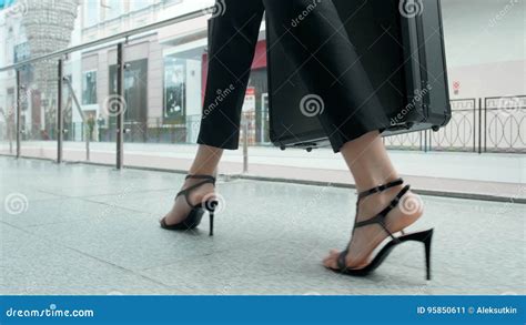 Young Female Passenger At The Airportclose Up On Legs With High Heels