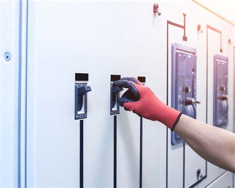 Premium Photo Engineer Checks The Operation Of Electrical Control Equipment
