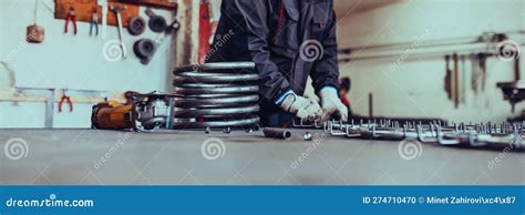 An Industrial Worker Processing Iron Structures And Preparing Them For