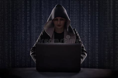 Masked Hacker Using Smartphone Hacking The Internet Stock Image