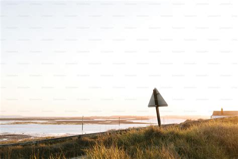 A Coastal Scene With A Triangle Marker Photo Sea Image On Unsplash