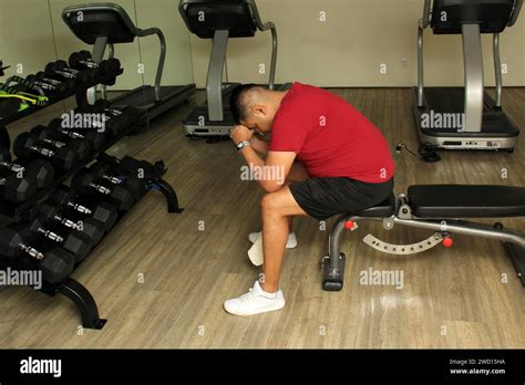 Dark Skinned Latino Adult Man Suffers From Muscle Fatigue Tiredness