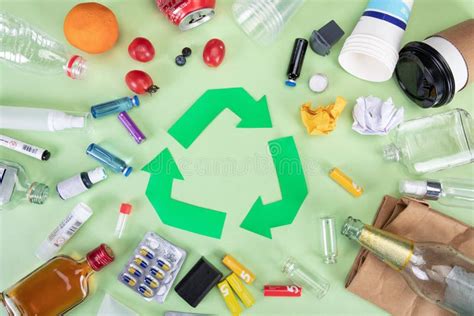 Top View Of Different Types Of Garbage With Recycling Sign In The Center Garbage Sorting Concept