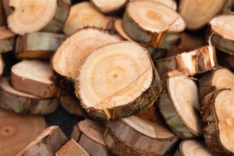 Dry Chopped Firewood Logs Stacked Up On Top Of Each Other In A Pile