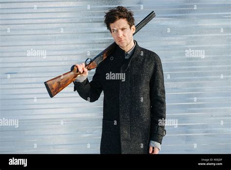 Man Shotgun Over Shoulder Hi Res Stock Photography And Images Alamy