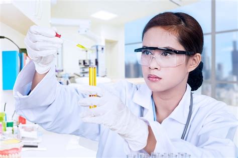 Premium Photo Scientist And Yellow Flask