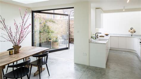 Giant Pivoting Door Connects Columbia Road Extension To Rear Courtyard