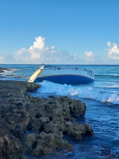 Coast Guard Clean Up Crews Remove Fuel And Oiled Debris From Derelict
