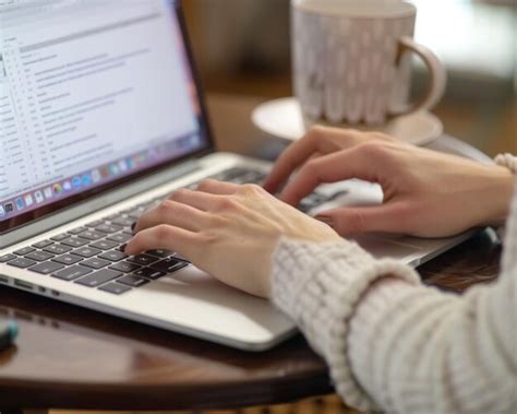 Premium Photo Person Typing Word Document On Laptop Labour Day Image