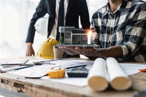 Architect Team Working With Blueprints For Architectural Plan Engineer