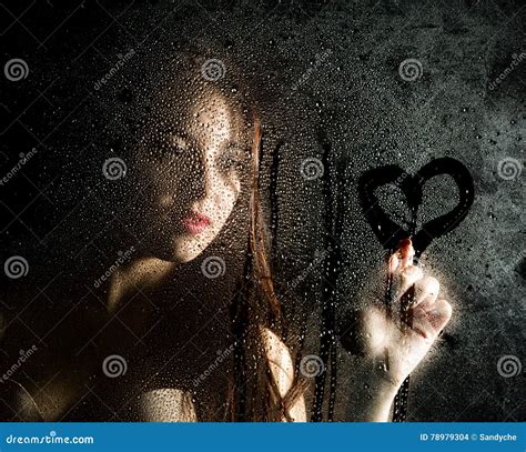 Smooth Portrait Of Model Posing Behind Transparent Glass Covered By