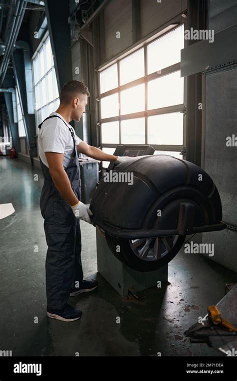 Mechanic Testing Technical Condition Of Car Wheel Stock Photo Alamy