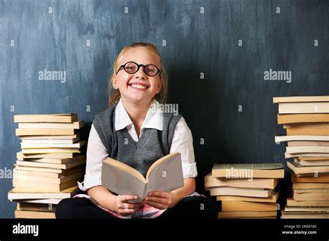 Shes Kind Of A Bookworm A Happy Blonde Girl Reading In Class