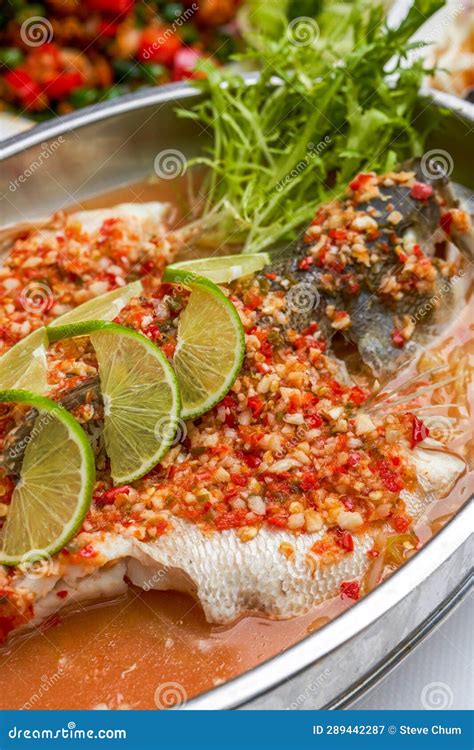 A Spicy Sea Bass With Chopped Peppers In Thai Sauce Stock Image Image