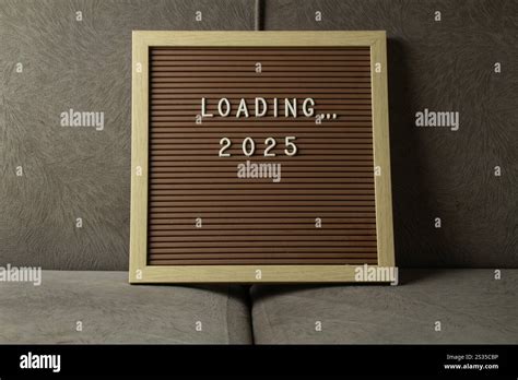 Letter Board Frame With Words Loading 2025 On Gray Velvet Texture