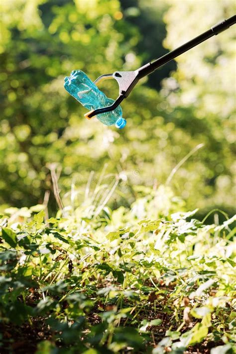 Trash Picker With Plastic Bottle Stock Image Image Of Nature Grass