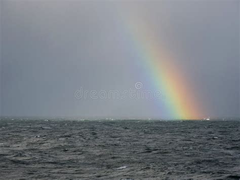 Colorful Rainbow Over Ocean Surface Nature Scene With Light Effect