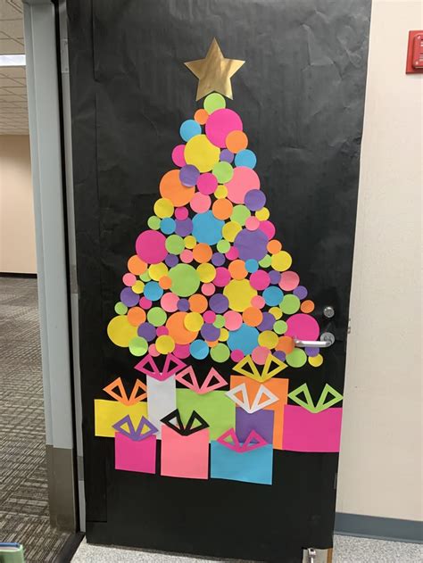 A Door Decorated To Look Like A Christmas Tree With Presents On It And
