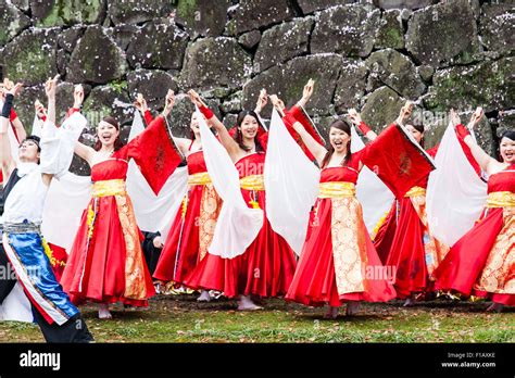 Japanese Yosakoi Dance Team Dancing In Front Of Castle Stone Wall