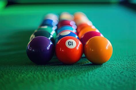 Premium Photo A Row Of Pool Balls Sitting On Top Of A Pool Table
