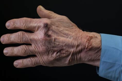 An Older Mans Hand With A Black Background Stock Illustration