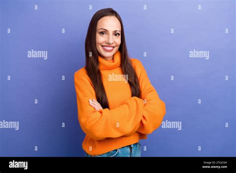 Portrait Of Cheerful Business Lady In Orange Trendy Turtleneck Folded
