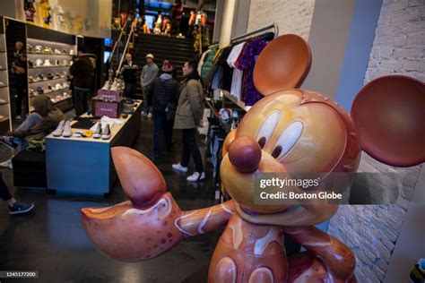 A Statue Of Mickey Mouse With Lobster Claws Is Displayed At The News