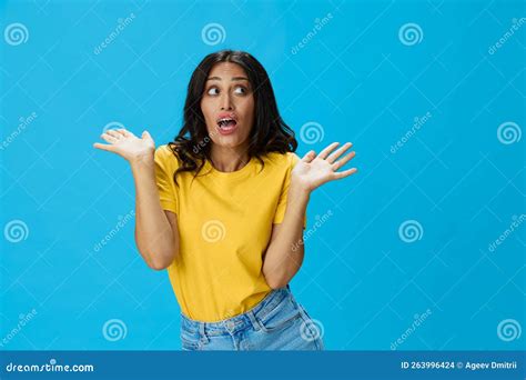 Woman In Yellow T Shirt On Blue Background Posing Gestures Emotions And