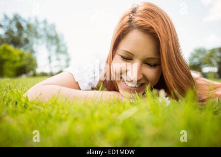 Pretty Redhead Happy And Lying Stock Photo Alamy