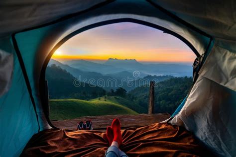 Woman Cross Leg On Blanket In Camping Tent With Sleeping Bags On