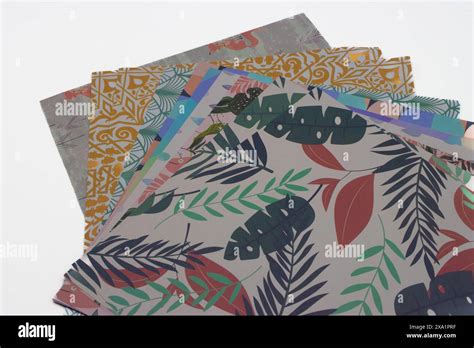 Multicolored Patterned Sheets Of Paper For Origami On White Background